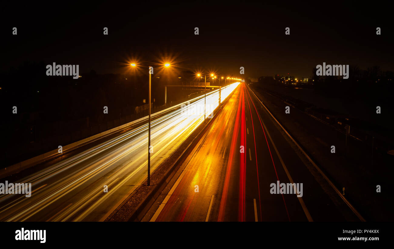 Highway at night with light trails Stock Photo - Alamy