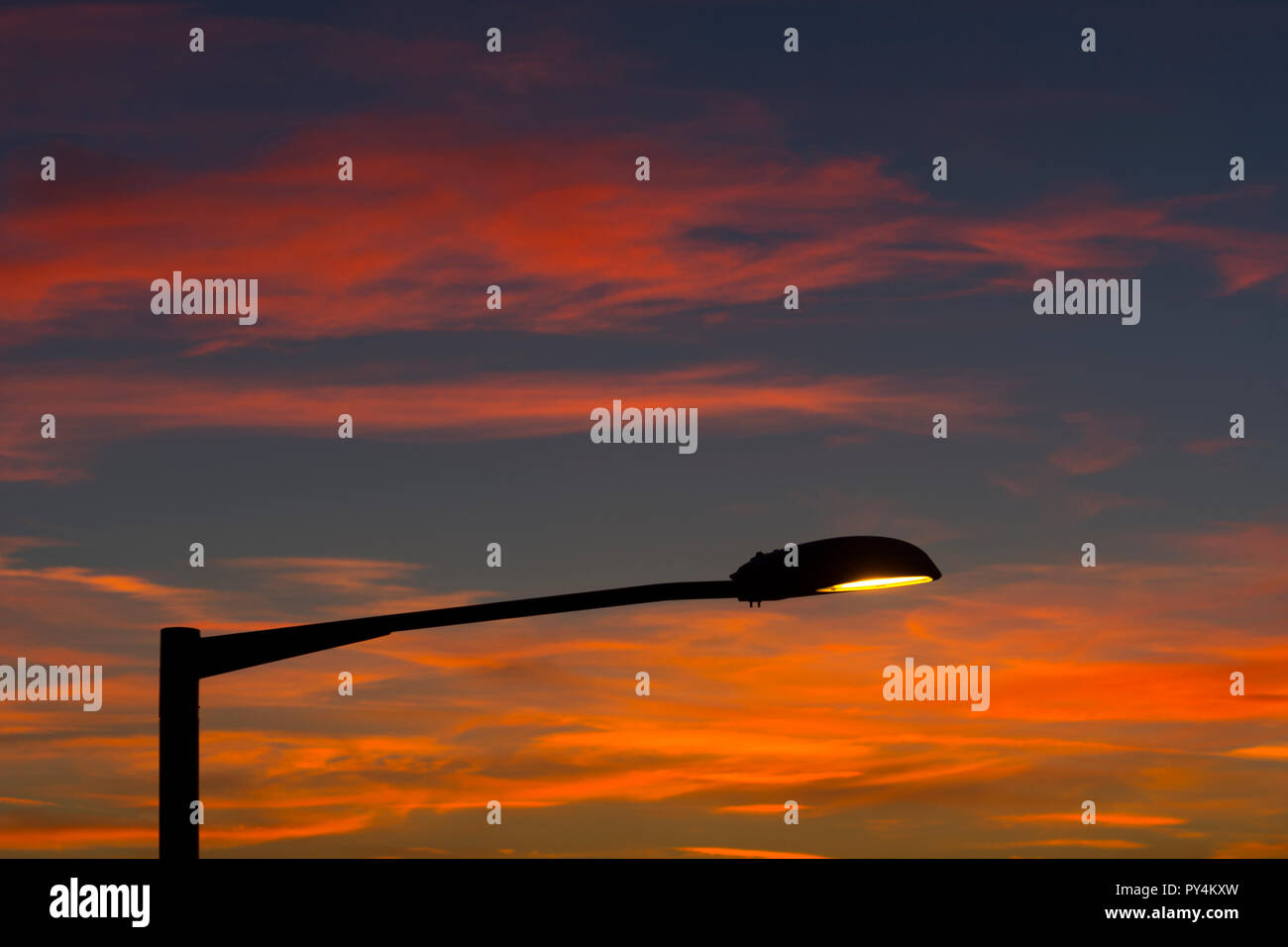 A street light seen against a sunset sky, UK Stock Photo - Alamy