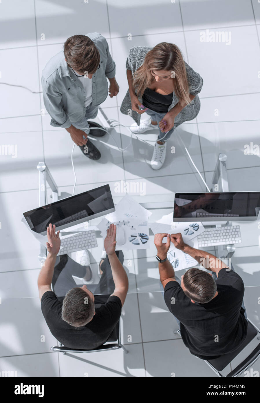 managers ask questions to employees Stock Photo - Alamy