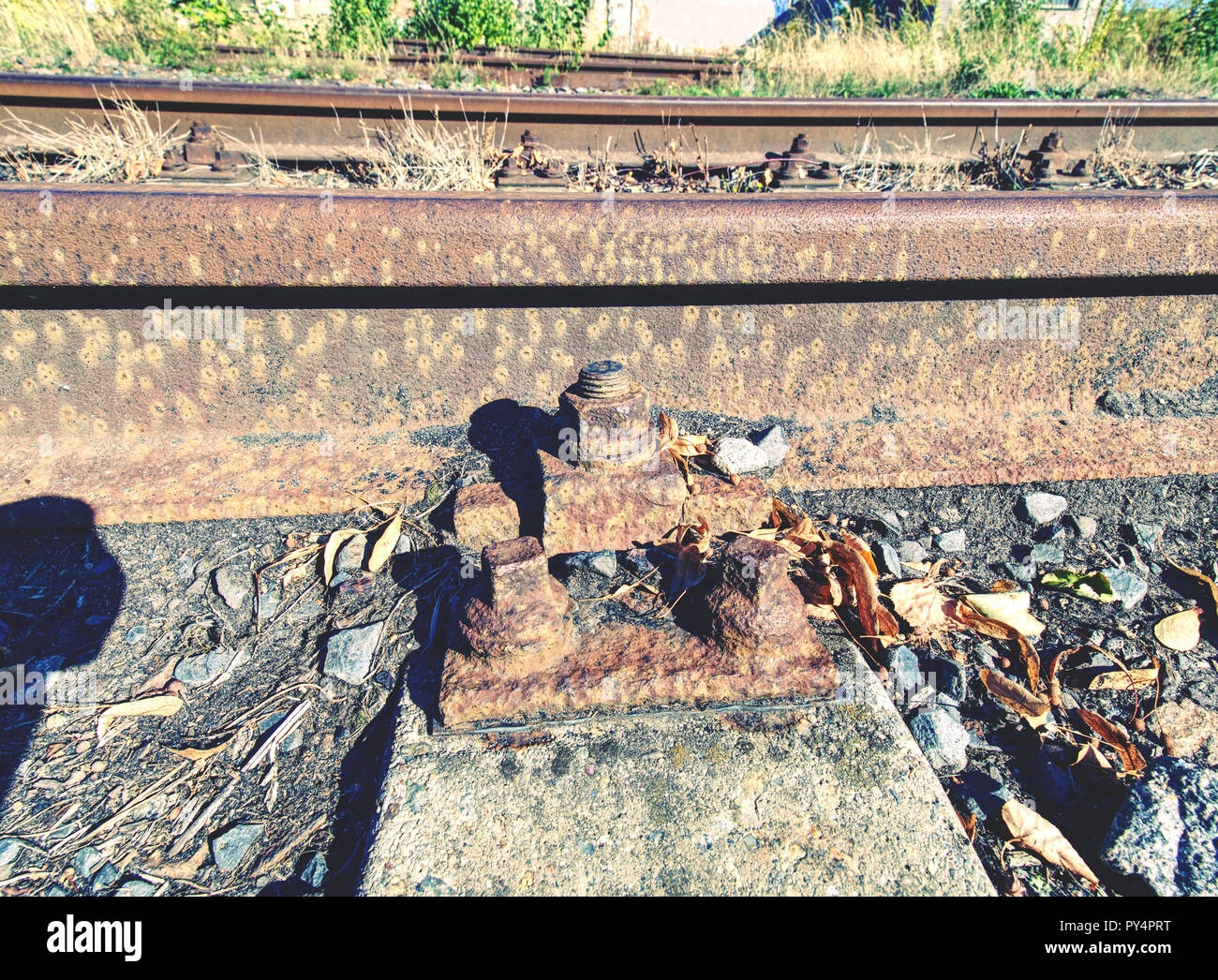 ap with nut and screw on the old rusty rail. Rusty train railway detail ...