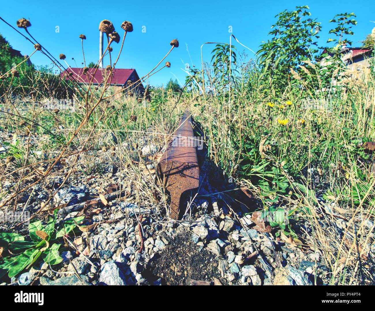 Autogen torch cut rail rod on rotten wooden sleeper. Repair of tramway ...