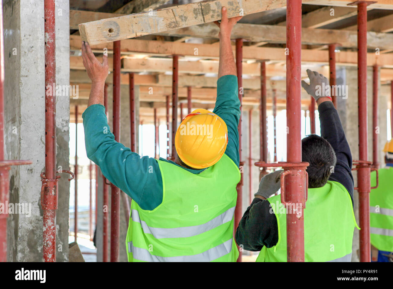 Construction worker on building site Stock Photo - Alamy