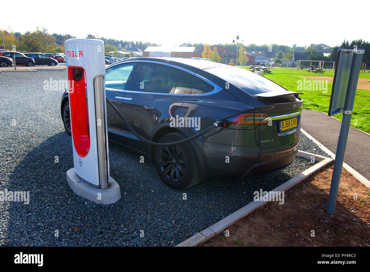 Charging car at Tesla. Electric charging point, UK Stock Photo - Alamy