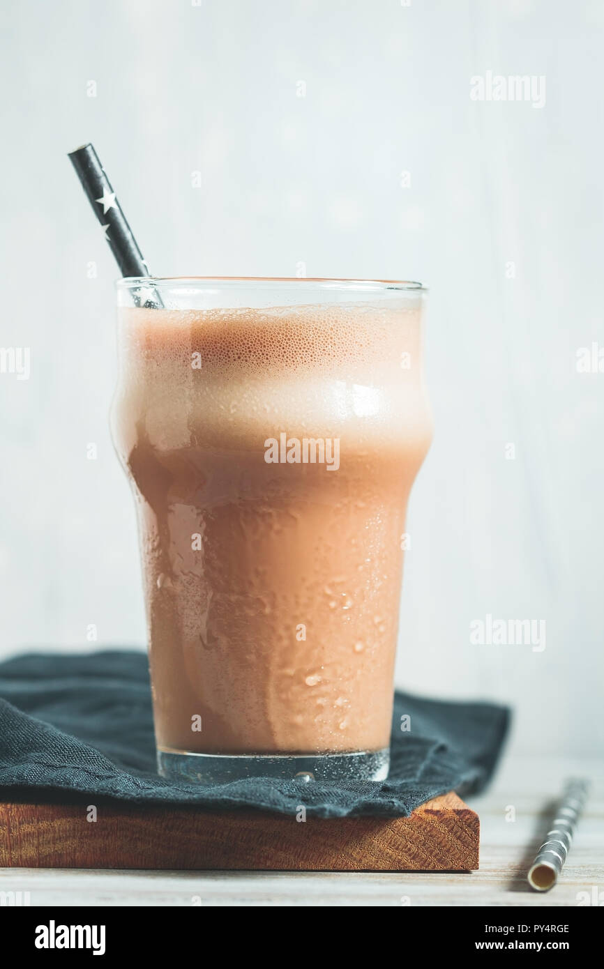 Chocolate protein shake in a glass. The concept of a healthy lifestyle ...