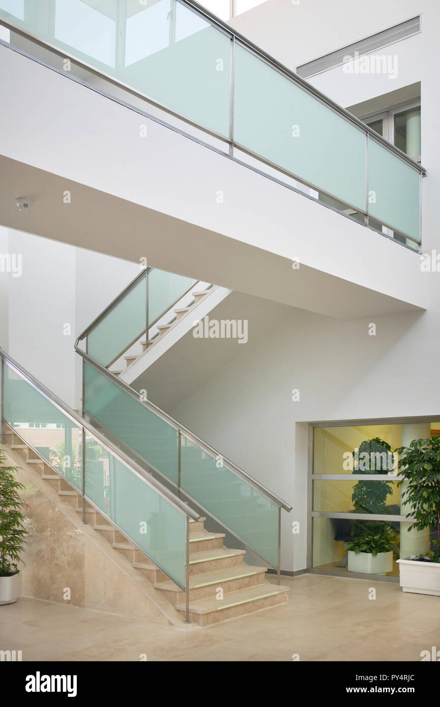 Modern building interior with staircase and walkway. Architecture and ...