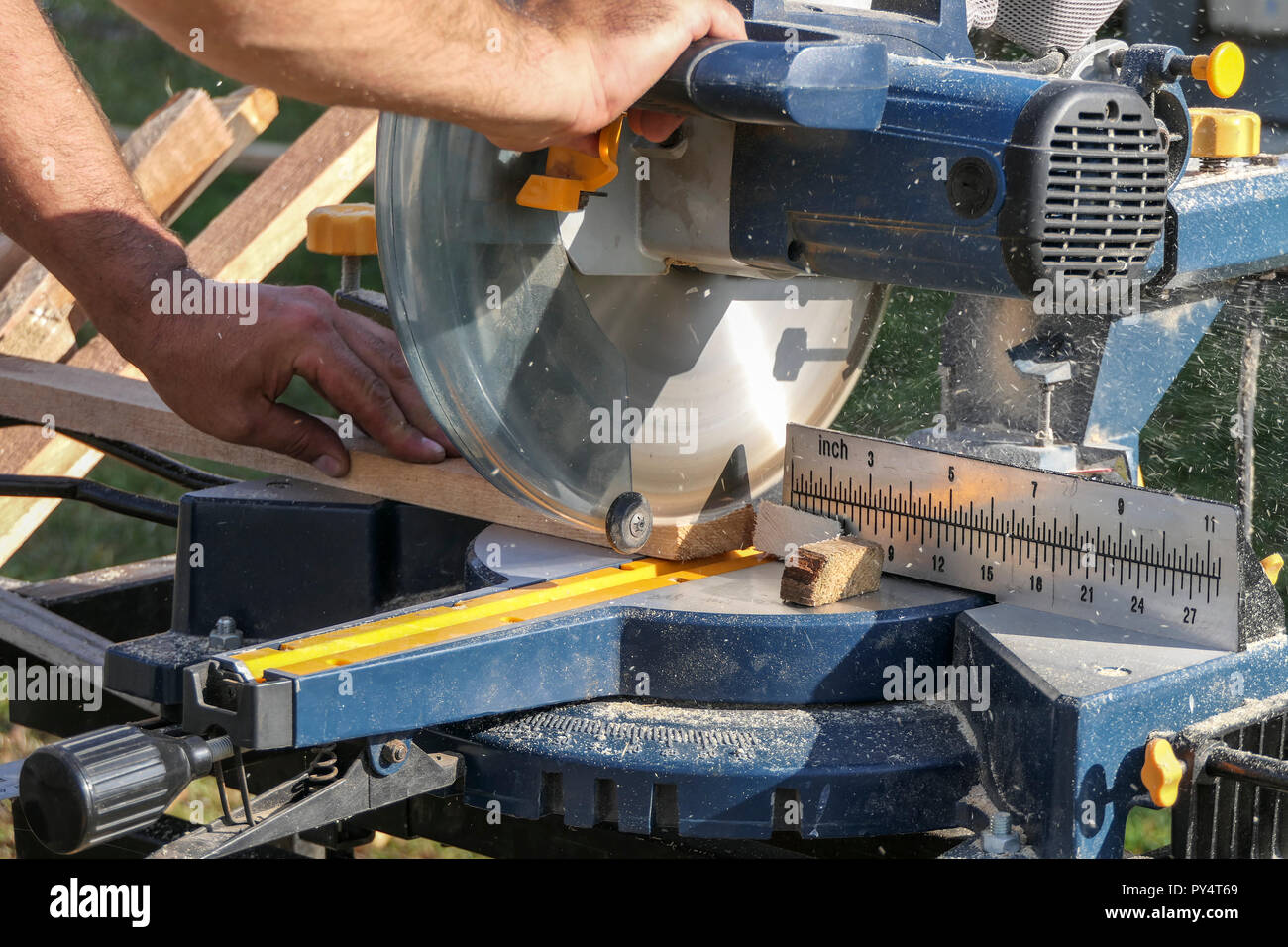 Roof construction building. Work on circular saw. Sawing wooden ...