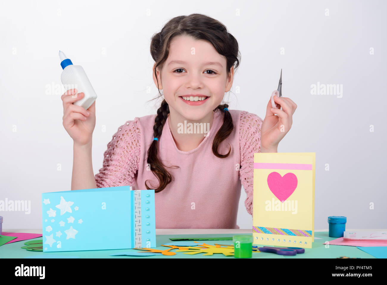 Happy girl and craft activity Stock Photo - Alamy