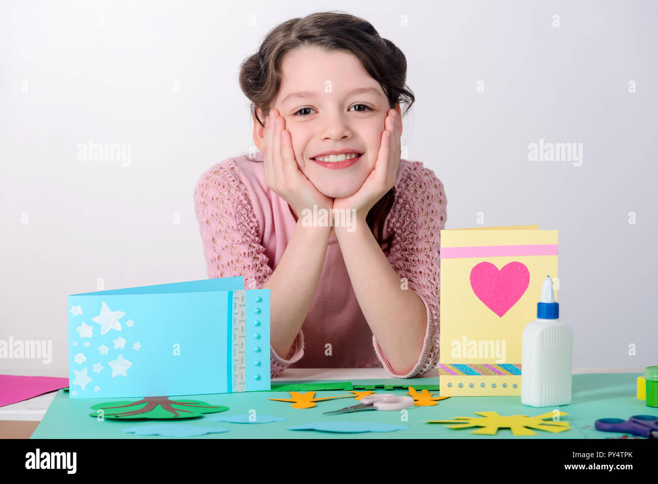 Girl resting after making cards Stock Photo - Alamy