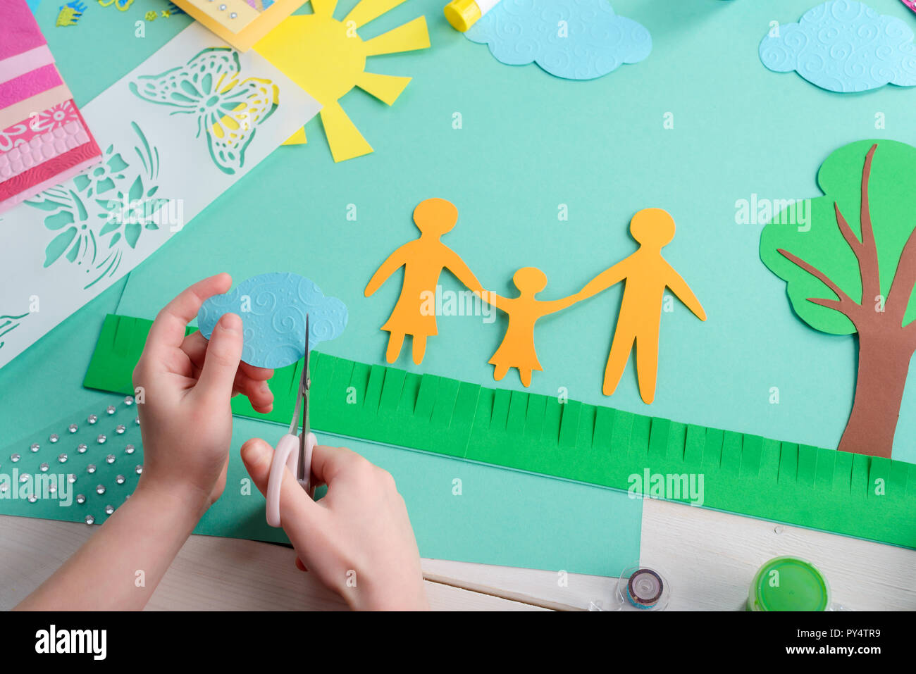 Child is cutting colored paper Stock Photo - Alamy