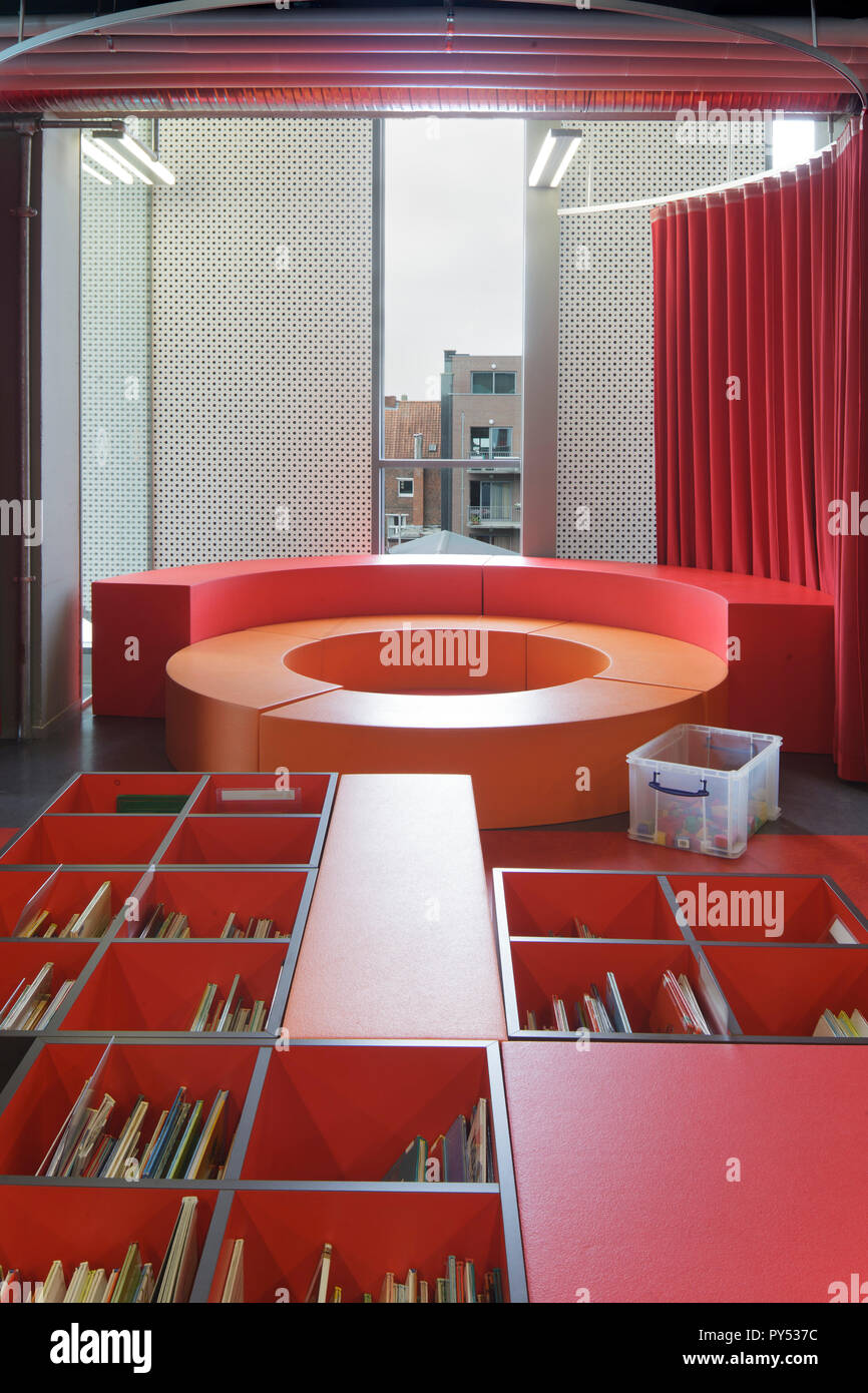 Red and orange circular seating in children's library. ARhus Knowledge ...