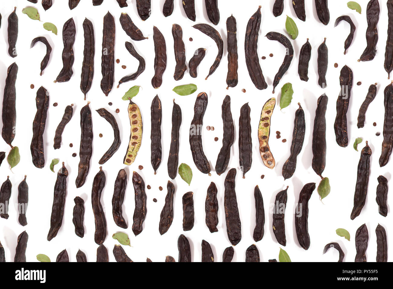 carob fruits assortment isolated over a white background Stock Photo ...