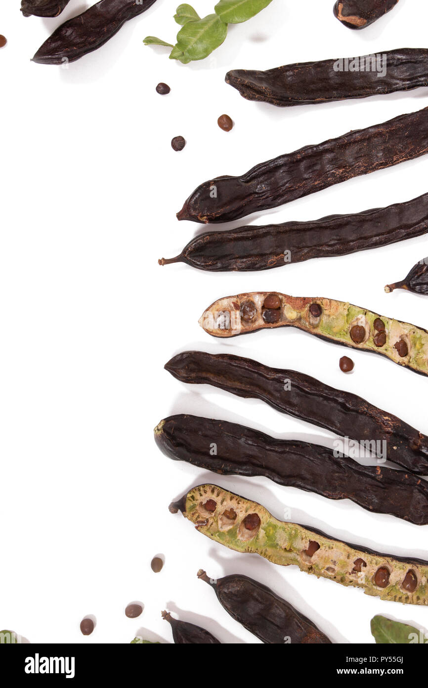 carob fruits assortment isolated over a white background Stock Photo ...