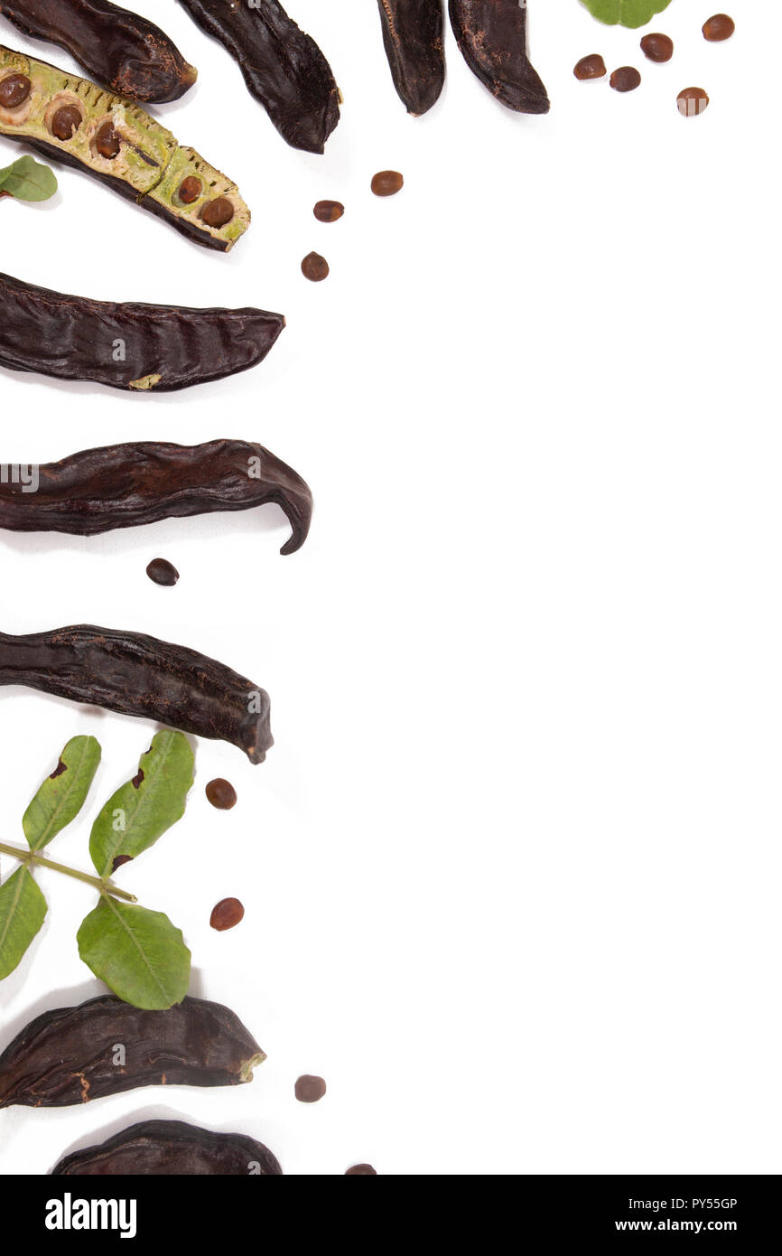 carob fruits assortment isolated over a white background Stock Photo ...