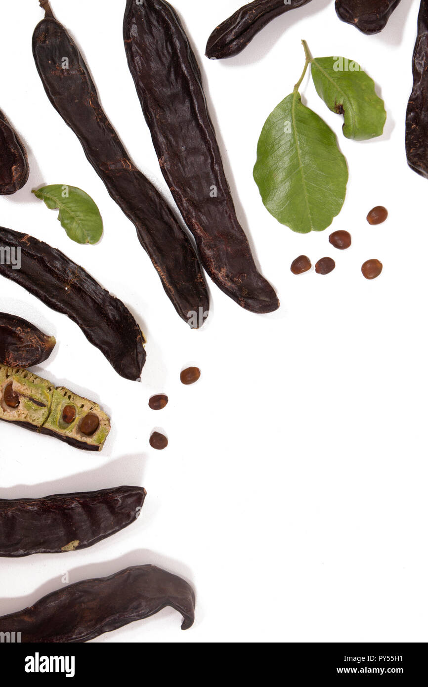 carob fruits assortment isolated over a white background Stock Photo ...