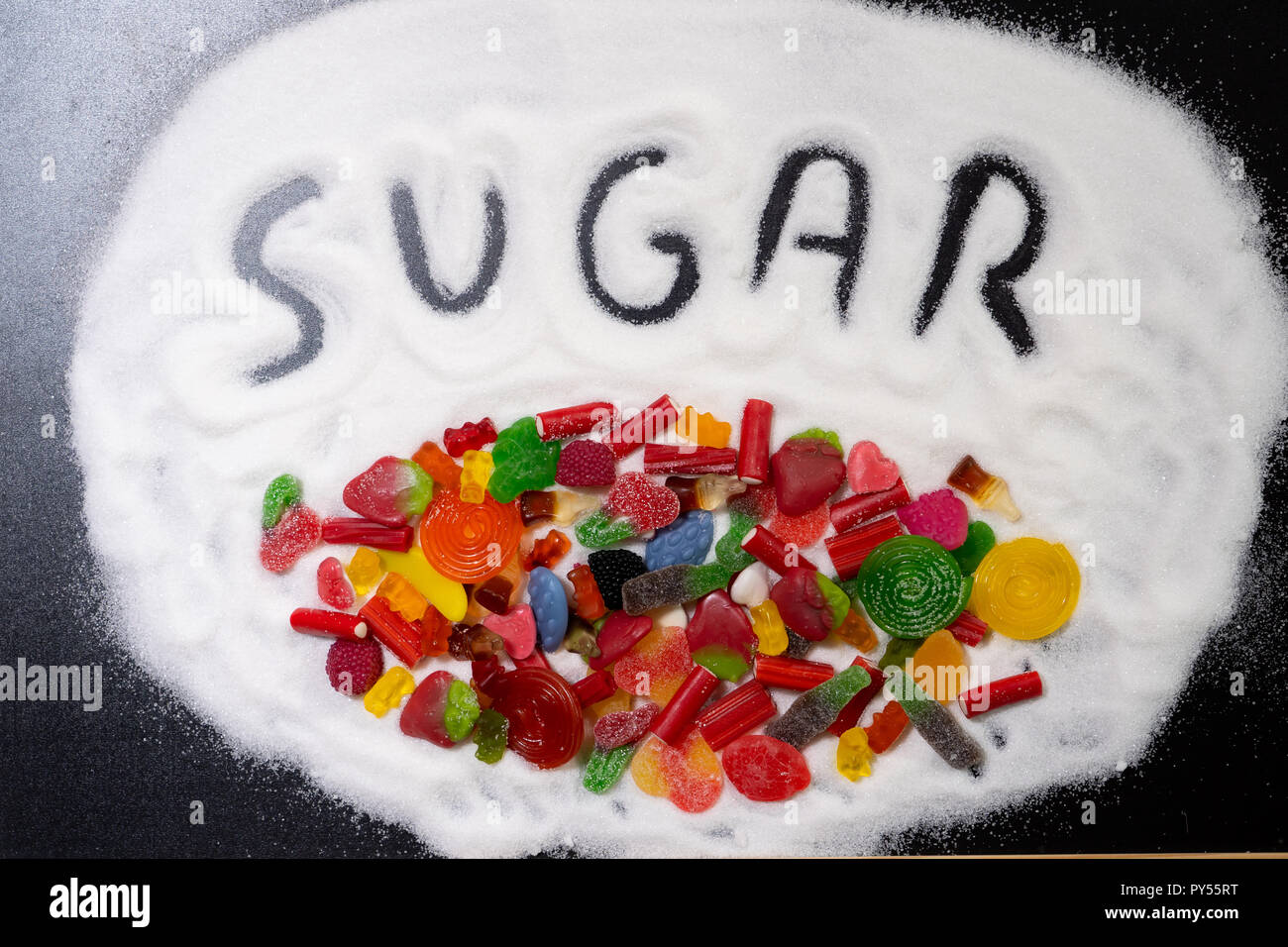 Colorful selection of different child sweets candies and treats with ...