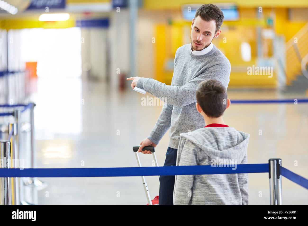 Father and son fly together on vacation and are traveling in the ...