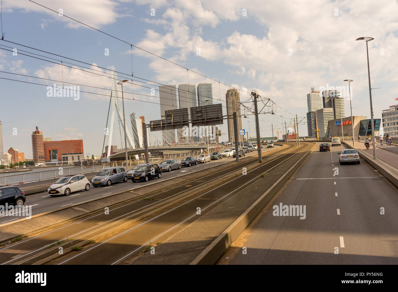 Rotterdam, Netherlands - 27 May: car driving on a city street filled ...