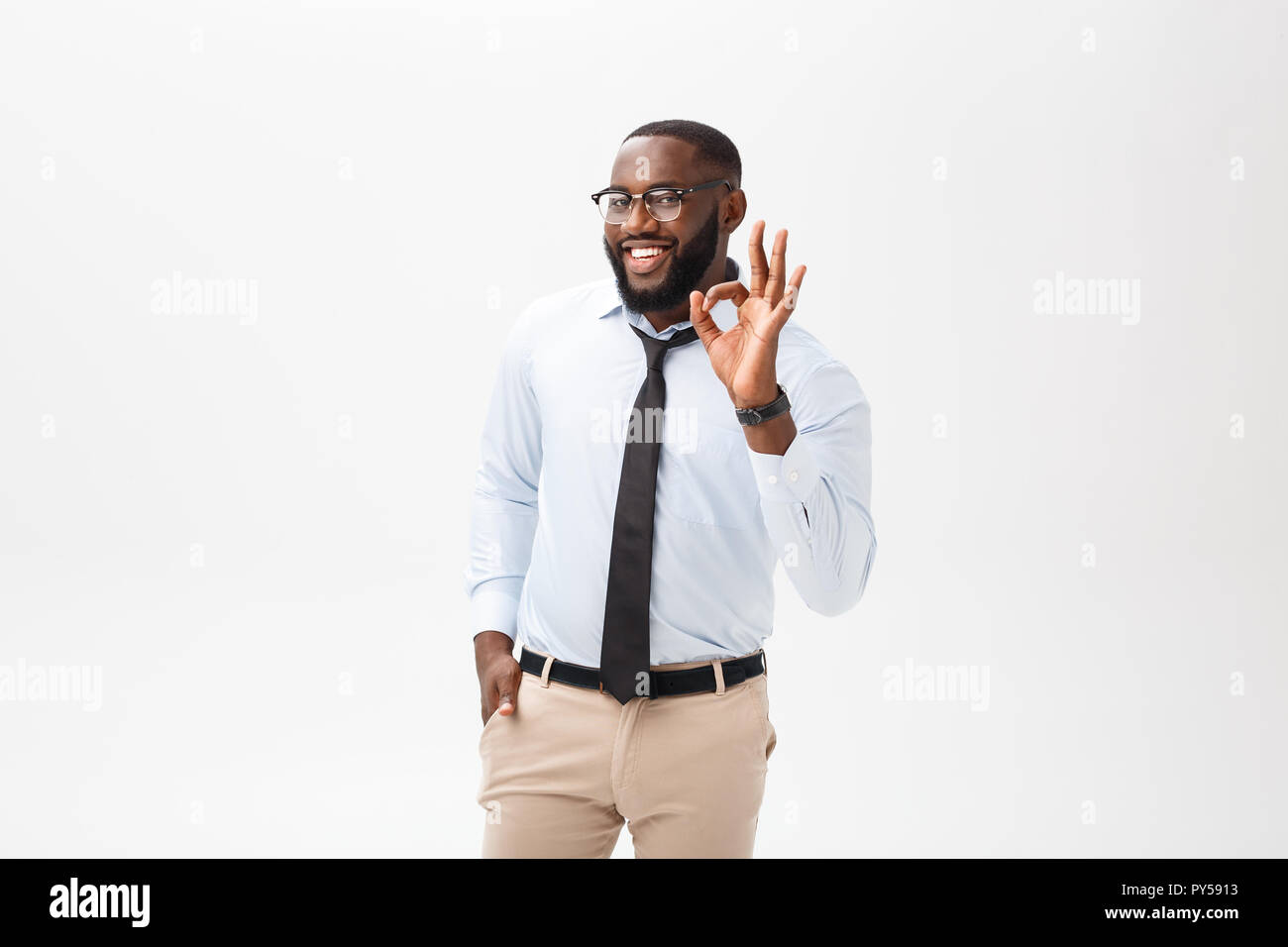 Young black businessman having happy look, smiling, gesturing, showing ...