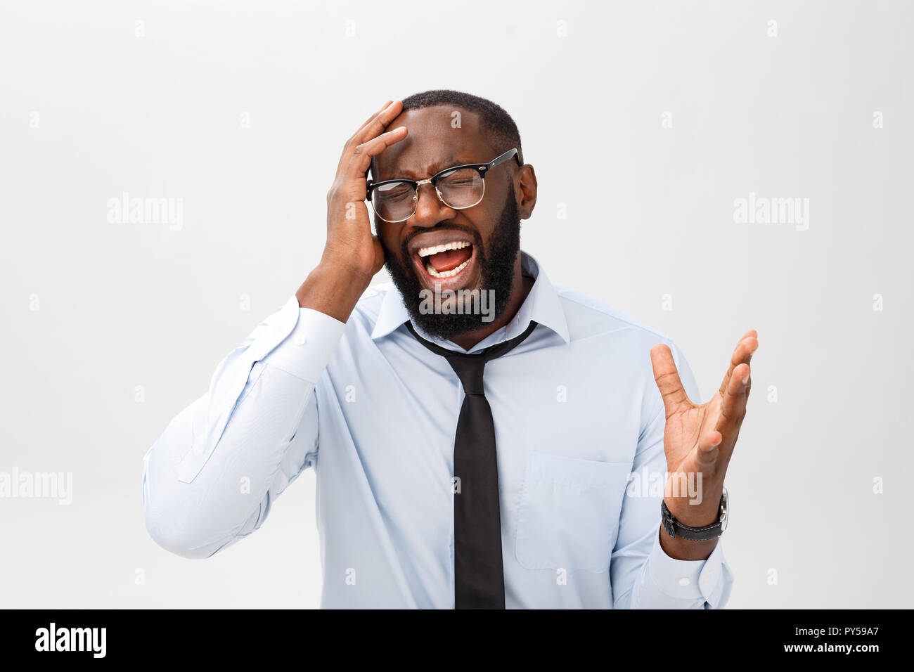 Portrait of desperate annoyed black male screaming in rage and anger ...