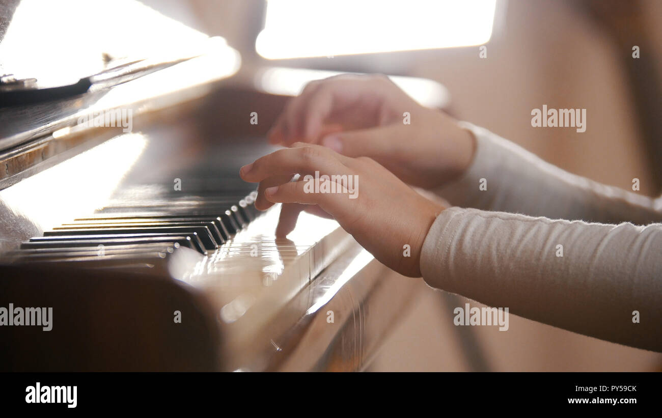 Baby learning learning the piano teaching hi-res stock photography and ...