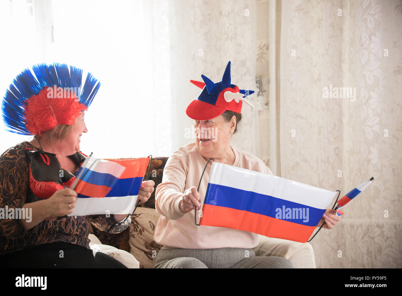 Two happy elderly women in russian accessories with flags Stock Photo ...
