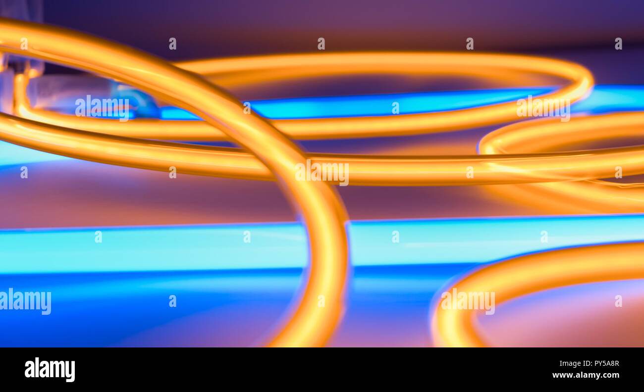 Lighting blue orange circle shape neon tube light Stock Photo - Alamy