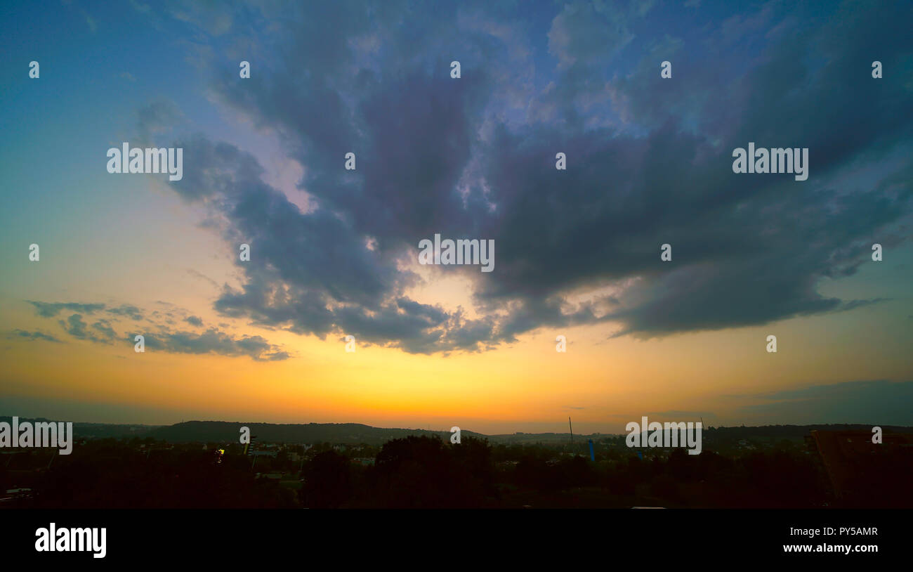 Beautiful sunset sky above clouds with dramatic light Stock Photo - Alamy