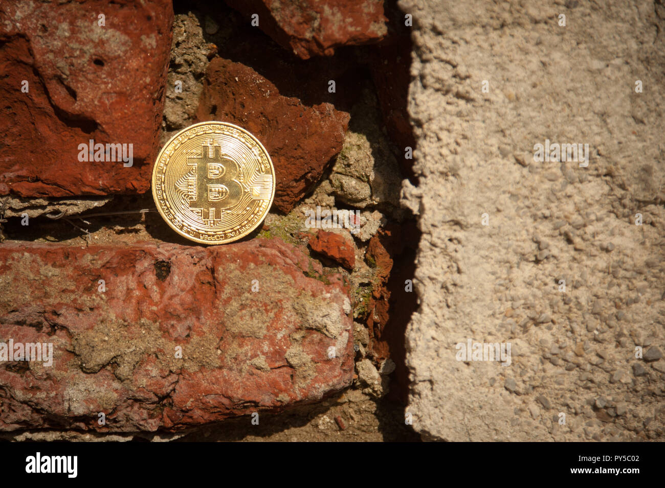 Bitcoin on bricks and wall Stock Photo - Alamy