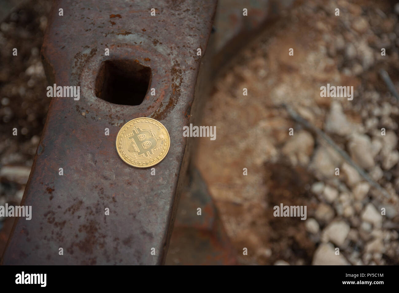 Bitcoin on anvil mine forge Stock Photo - Alamy