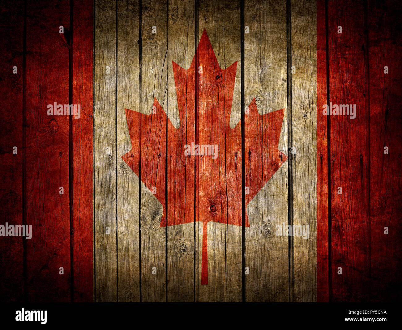 Very old dark brown wooden planks background with Canadian flag painted ...