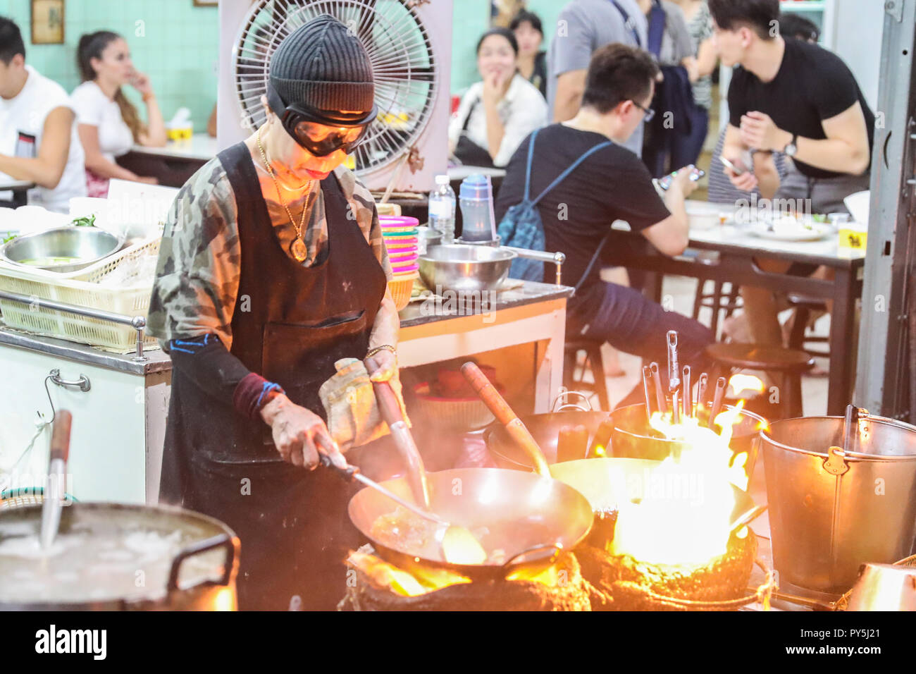 Bangkok, Thailand. 24th Oct, 2018. Supinya Junsuta cooks at Jay Fai in Bangkok, Thailand, Oct ...