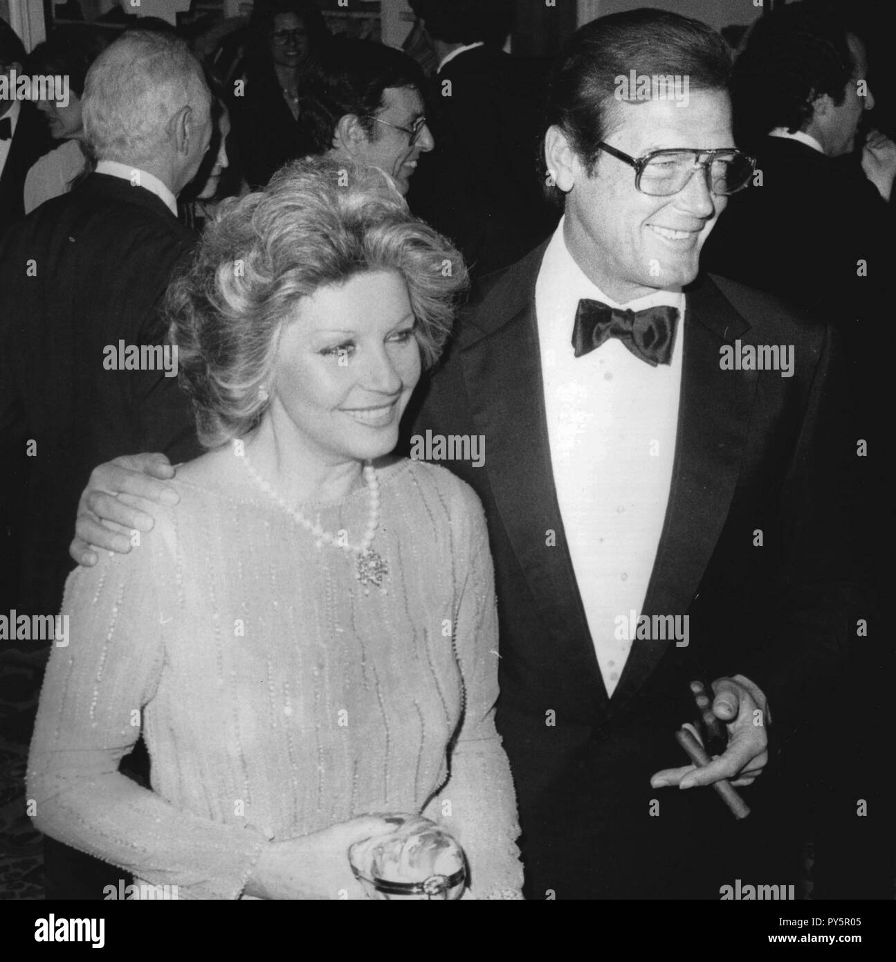 New York City, USA. 01st Jan, 2005. Roger Moore and wife Undated Photo ...