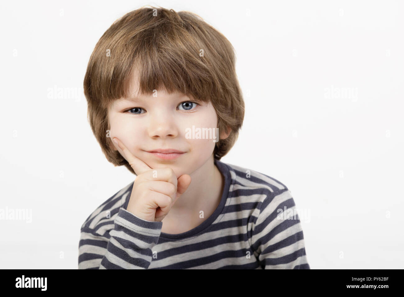 Smart little boy's portrait with serious thinking face the white ...