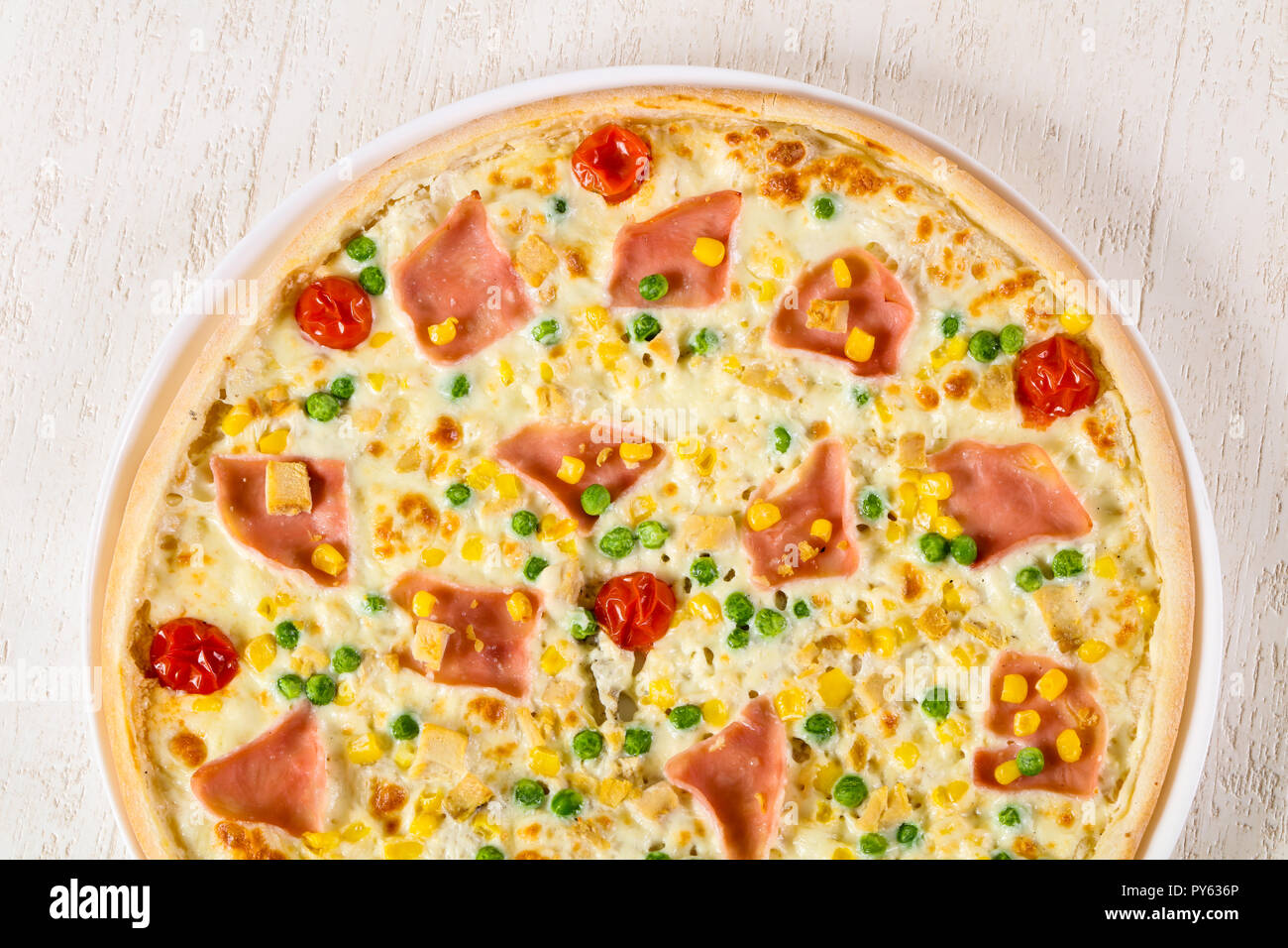 Pizza with ham and cheese Stock Photo - Alamy