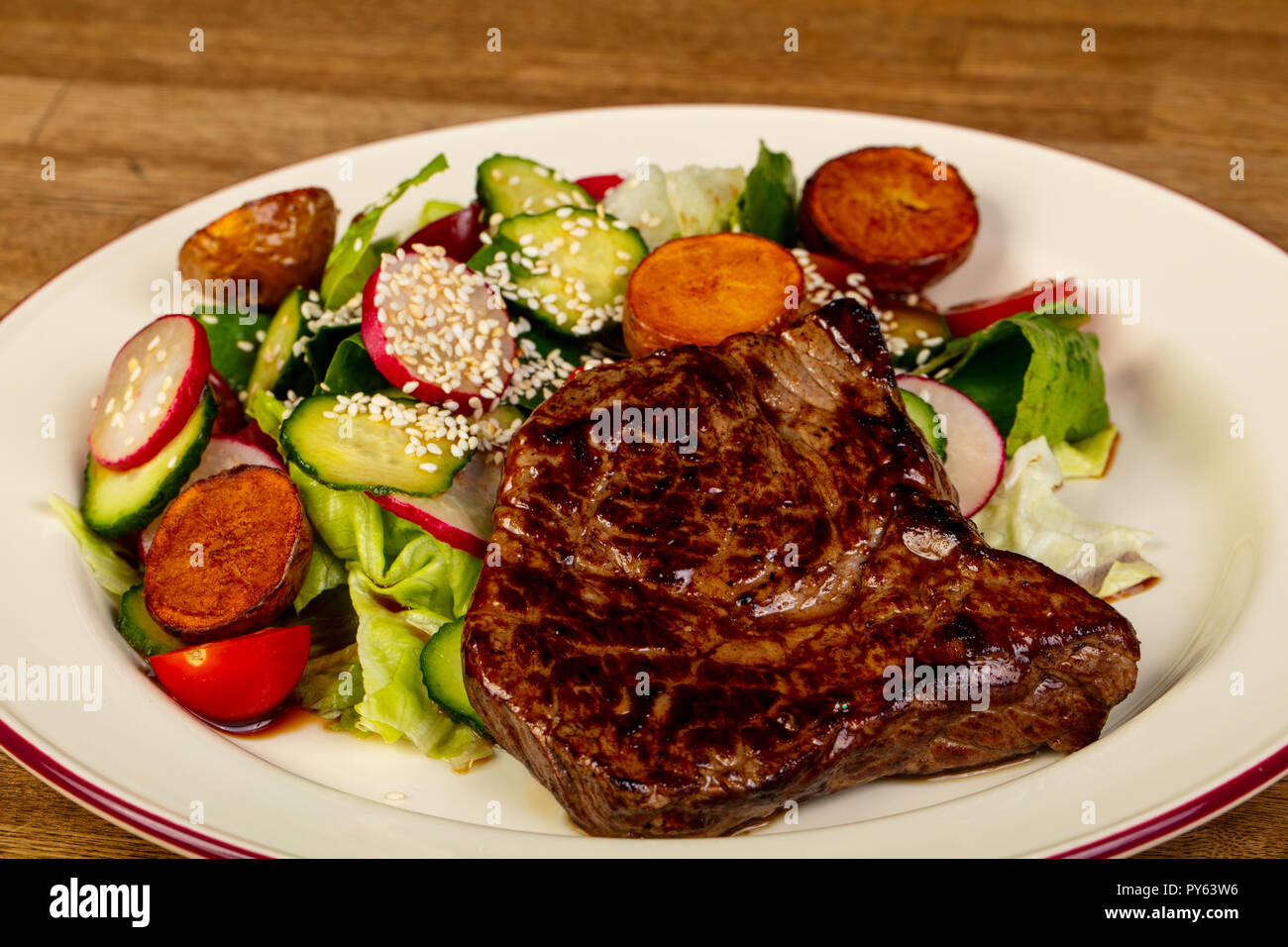 Beef steak salad with radish Stock Photo - Alamy
