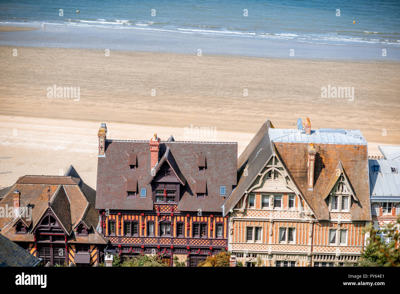 Luxury houses on the coastline with beautiful beach on the background ...