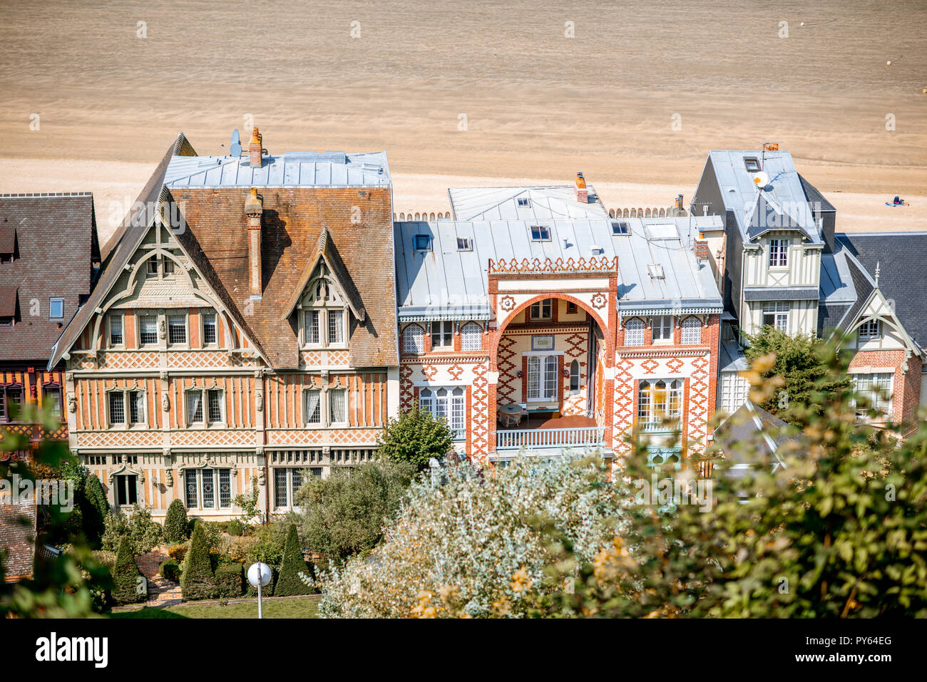 Luxury houses on the coastline with beautiful beach on the background ...