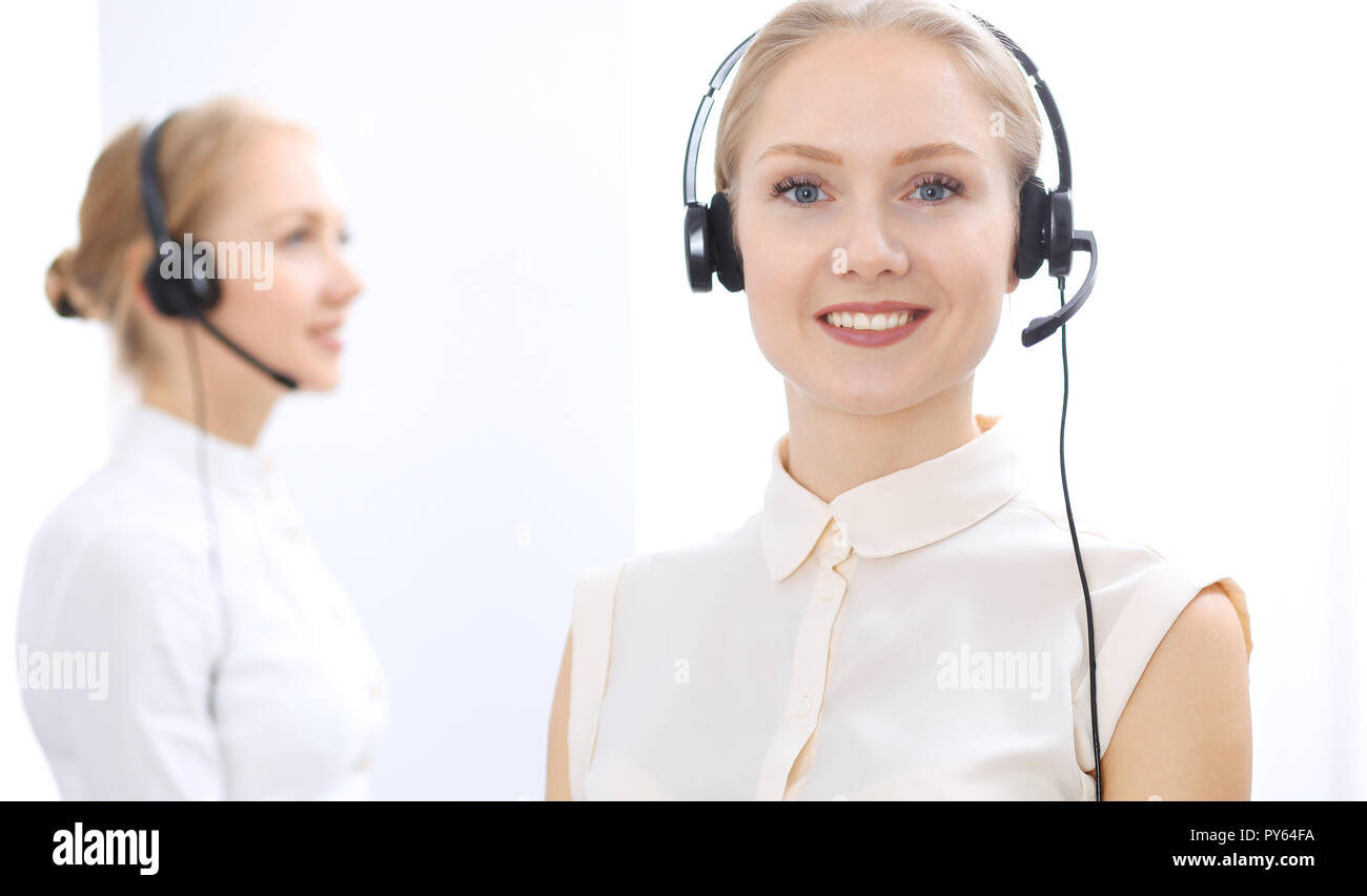 Bright call center office. Two blonde women in a headset Stock Photo ...