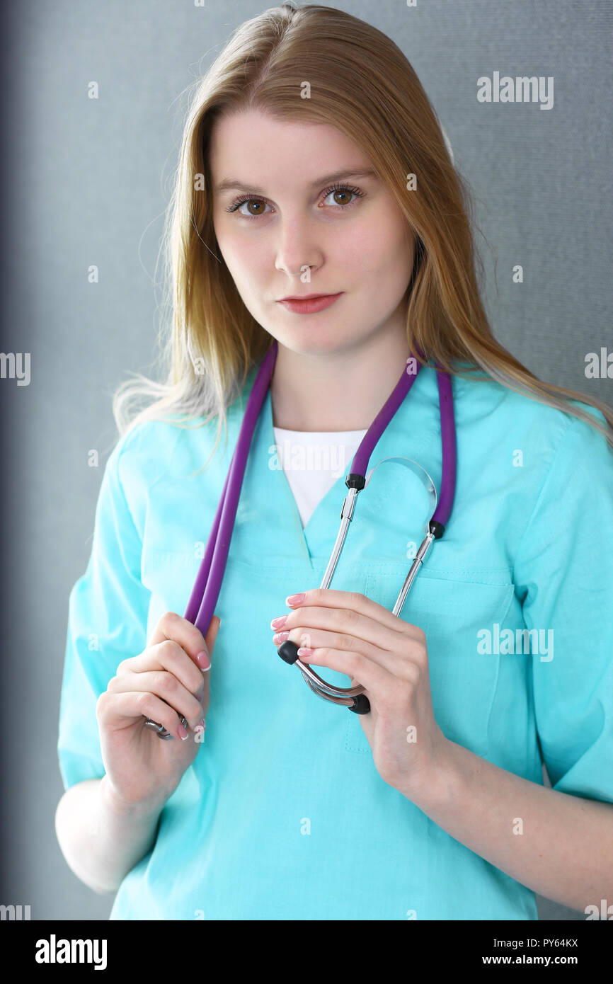 Doctor woman portrait with stethoscope. Young female surgeon or nurse ...