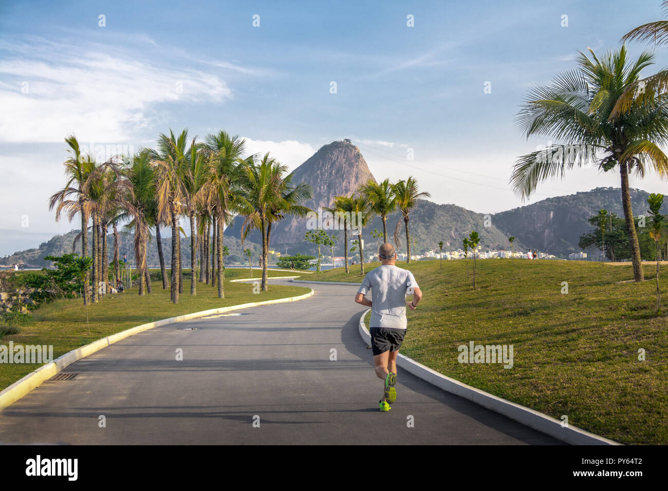 Man running at Marina da Gloria track and Sugar Loaf Mountain on ...