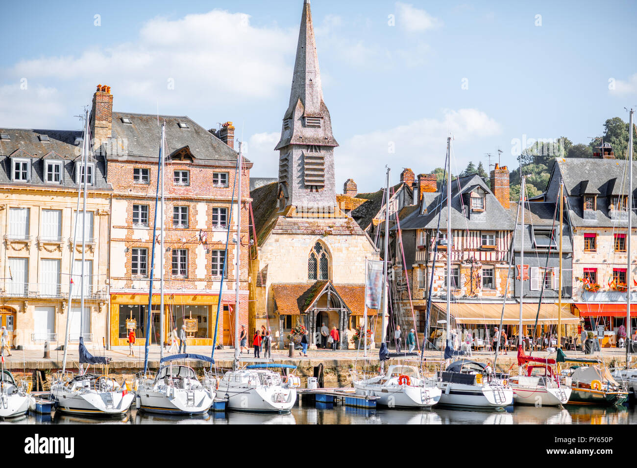 Waterside with ancient buildings and church in Honfleur, famous french ...