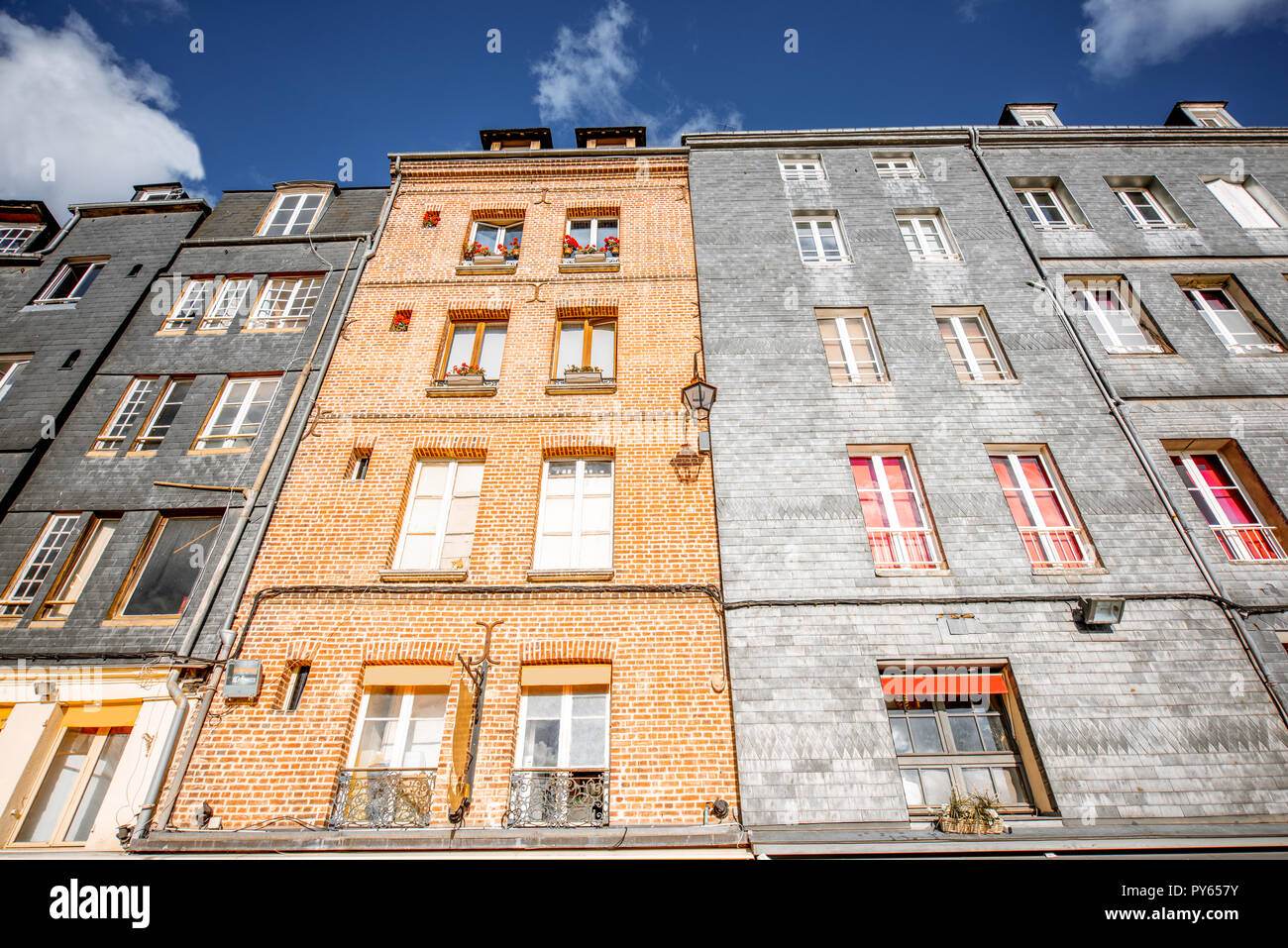 Beautiful facades of the old buildings at the harbour of Honfleur ...