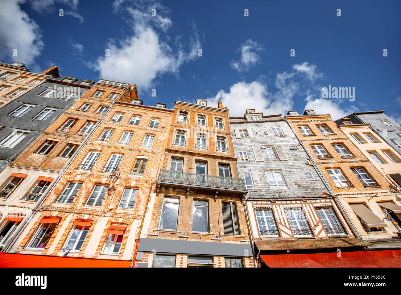 Beautiful facades of the old buildings at the harbour of Honfleur ...
