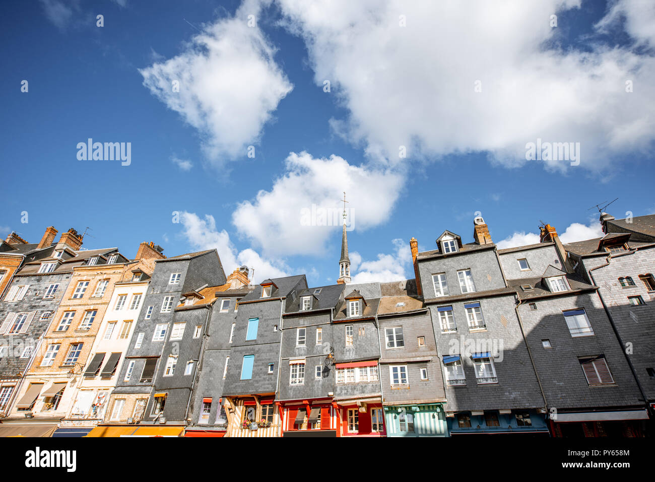 Beautiful facades of the old buildings at the harbour of Honfleur ...