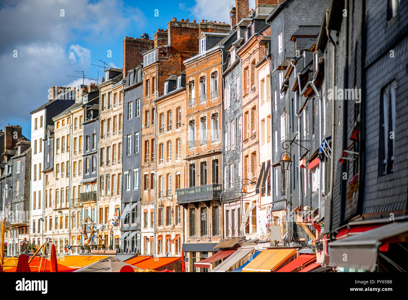 Beautiful facades of the old buildings at the harbour of Honfleur ...