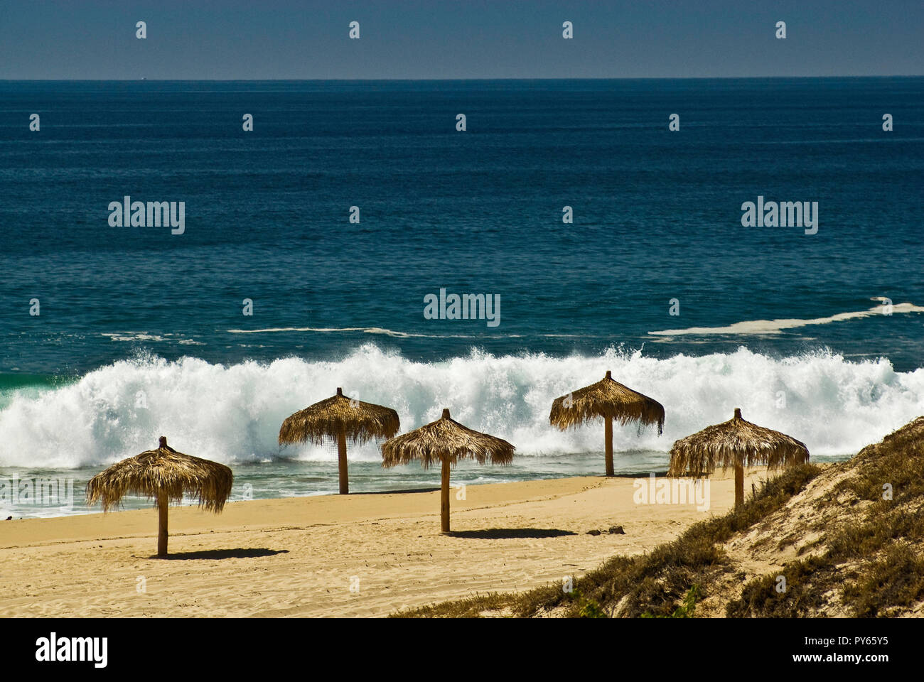 Big waves, palapas on Gulf of California (Sea of Cortez) beach near ...
