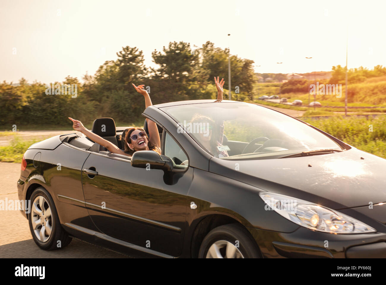 Girls driving convertible hi-res stock photography and images - Alamy