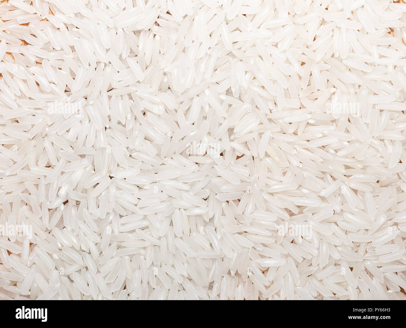 Asian white rice or uncooked. Food background Stock Photo - Alamy