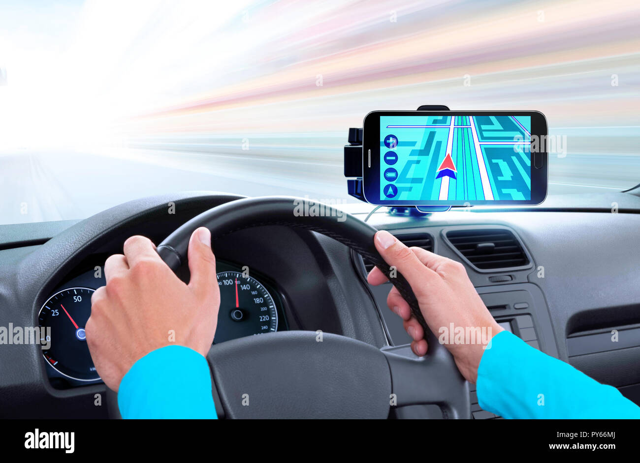 navigator on dashboard and hands of driver that sits on driver's seat ...