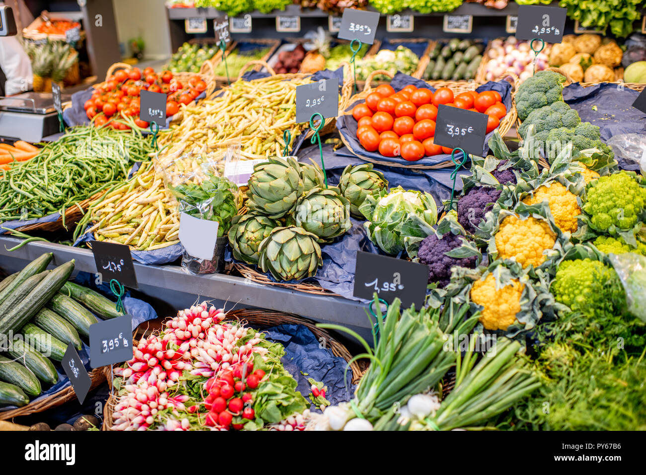 Variety of beautifully organized fruits and vegetables on the counter ...